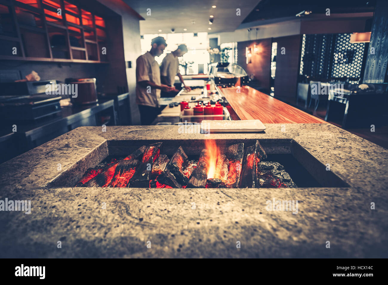 modern restaurant with fireplace Stock Photo - Alamy