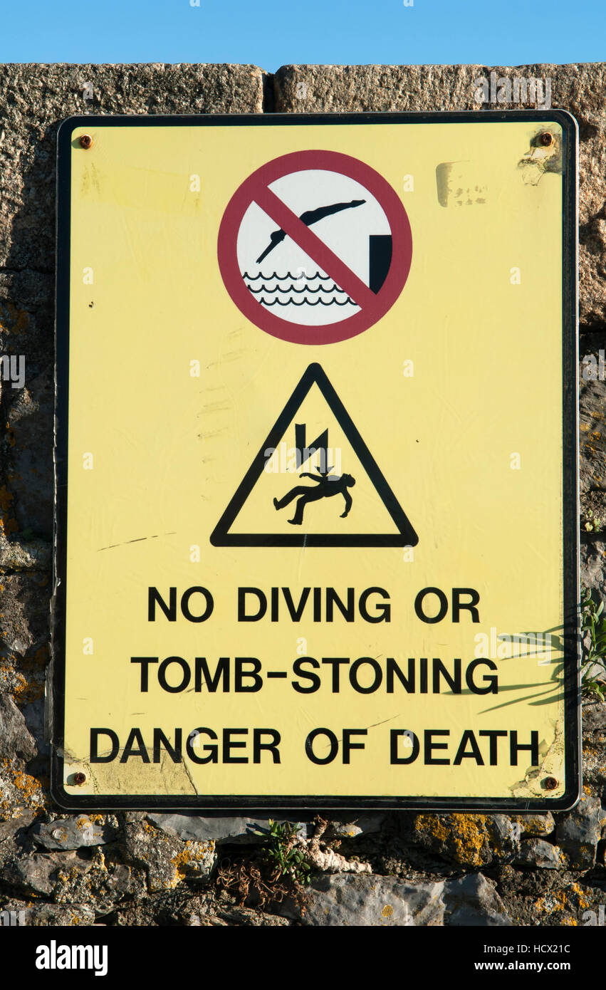 Tomb stoning and Diving warning sign. HOMER SYKES Stock Photo - Alamy