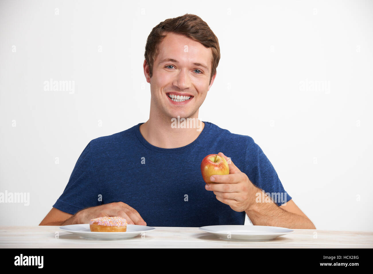 Man eating fruit snack hi-res stock photography and images - Alamy