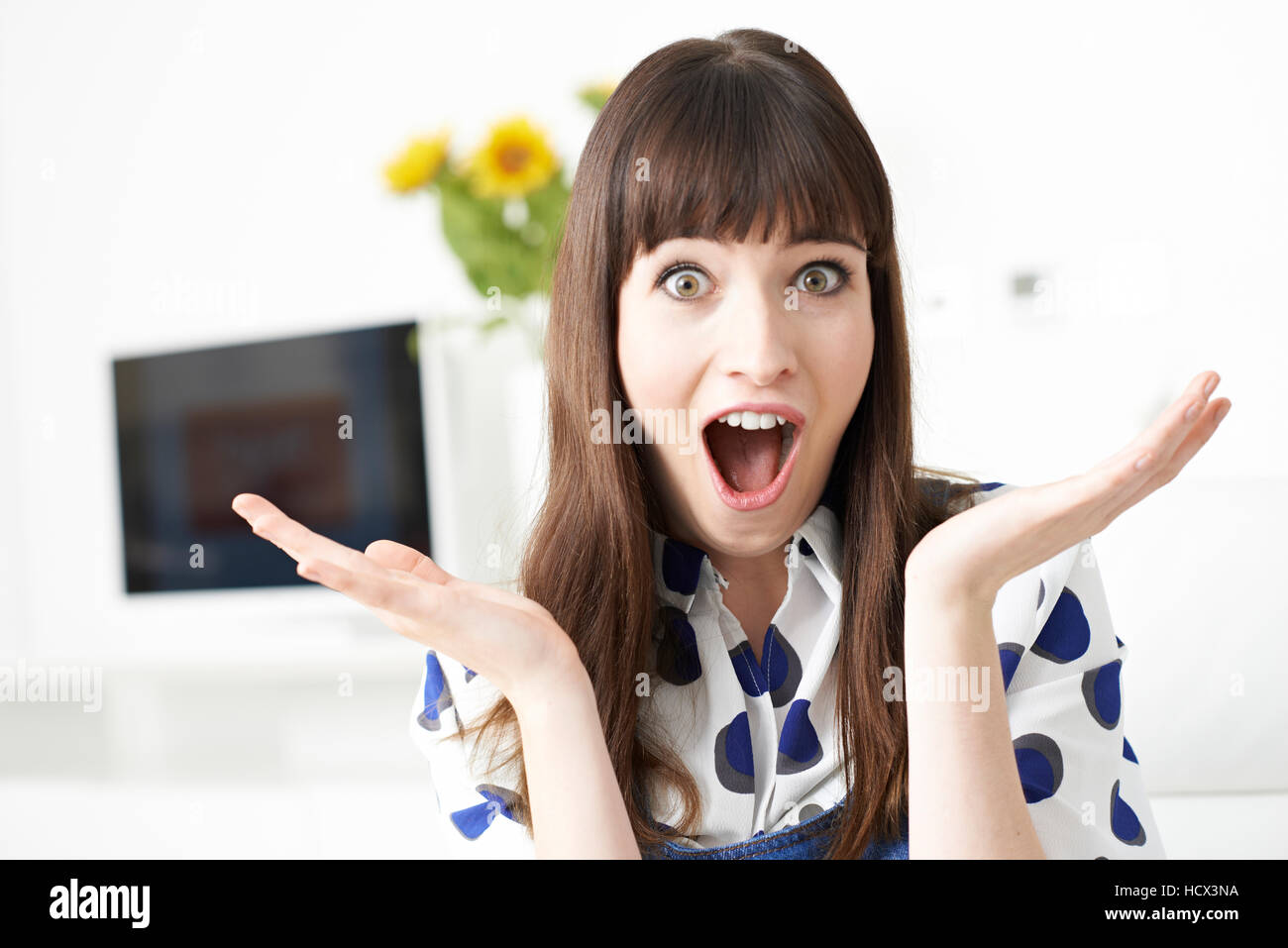 Young Woman Making Shocked Gesture With Hands Stock Photo - Alamy