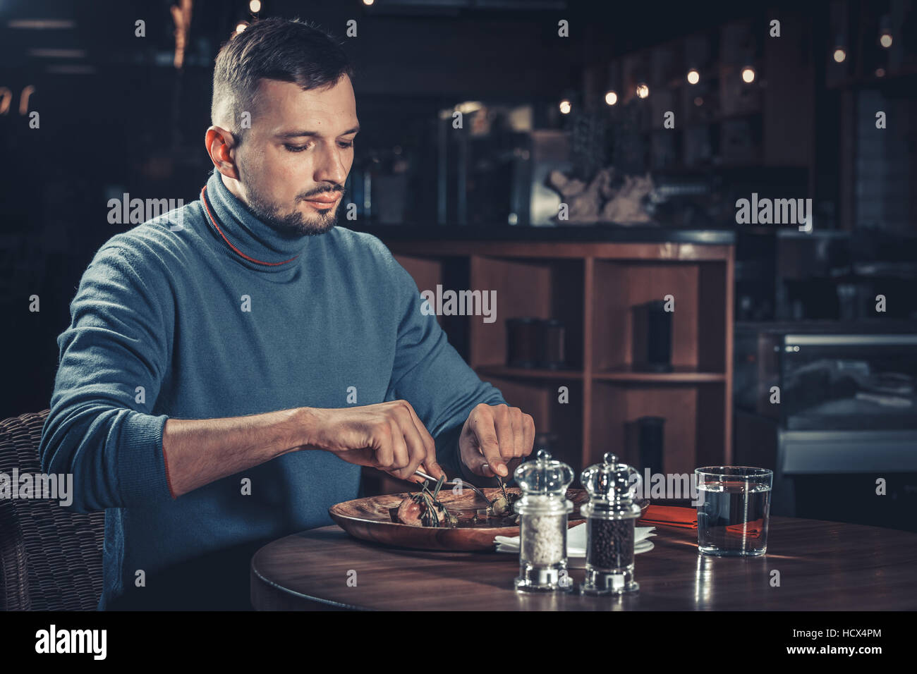 Handsome man at restaurant Stock Photo - Alamy