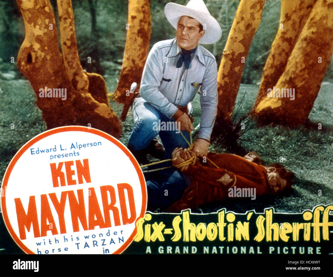 SIX SHOOTIN' SHERIFF, kneeling: Ken Maynard, 1938 Stock Photo - Alamy