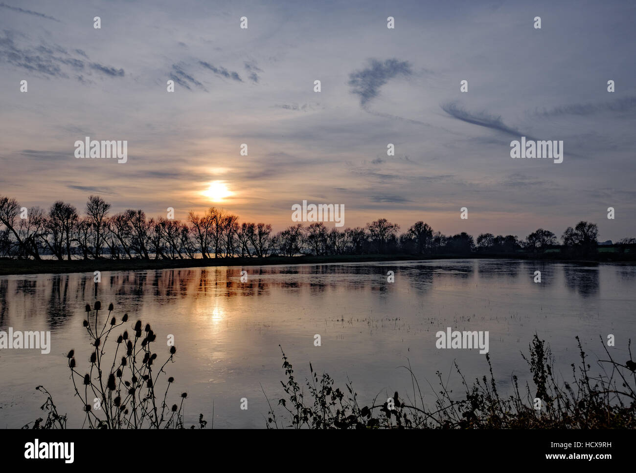 Sunset over a large nature reserve within a nature lake area of ...