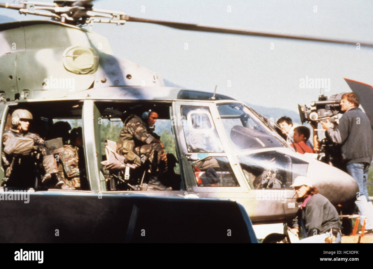 THE PEACEMAKER, George Clooney (in helicopter) filming a scene on set ...