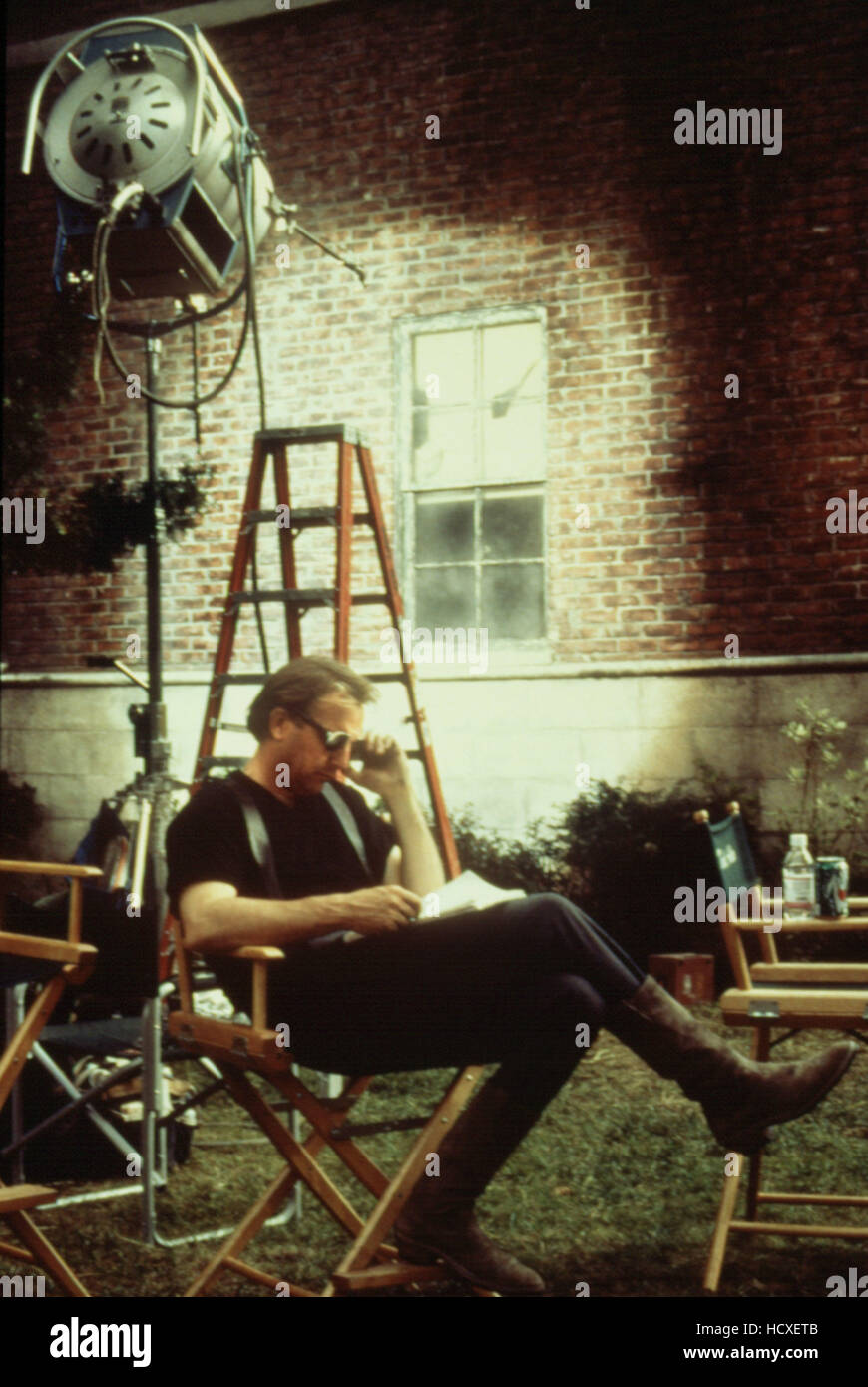THE POSTMAN, Kevin Costner studying the script on the set, 1997 Stock ...