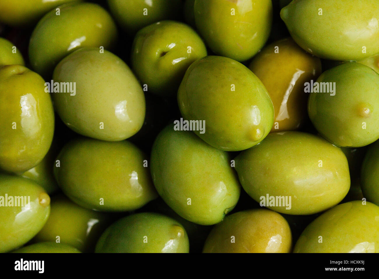 Green olives background. Top view food vegetarian Stock Photo - Alamy