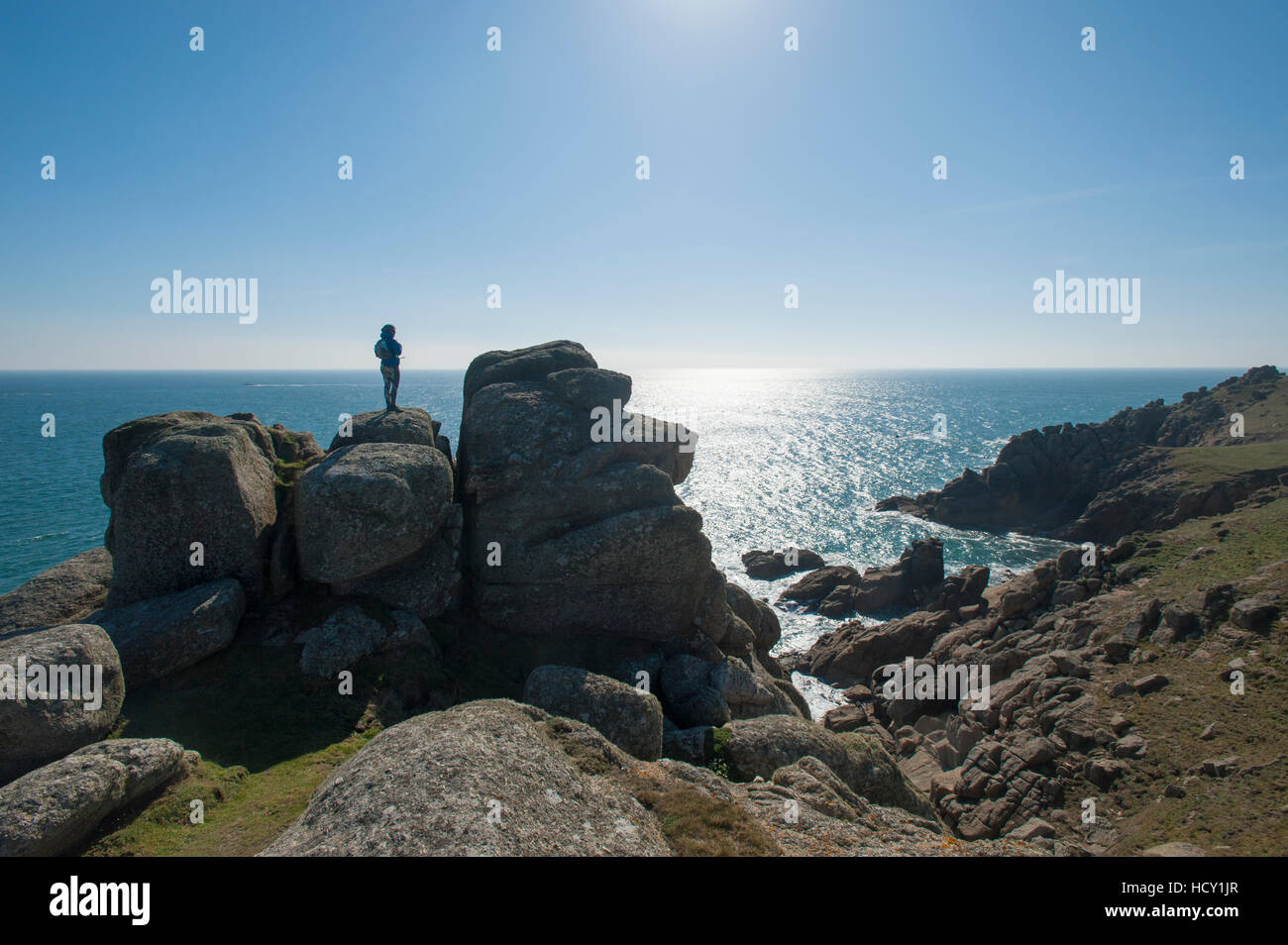 Standing near Logan Rock at the top of Treen Beach, Cornwall, the ...