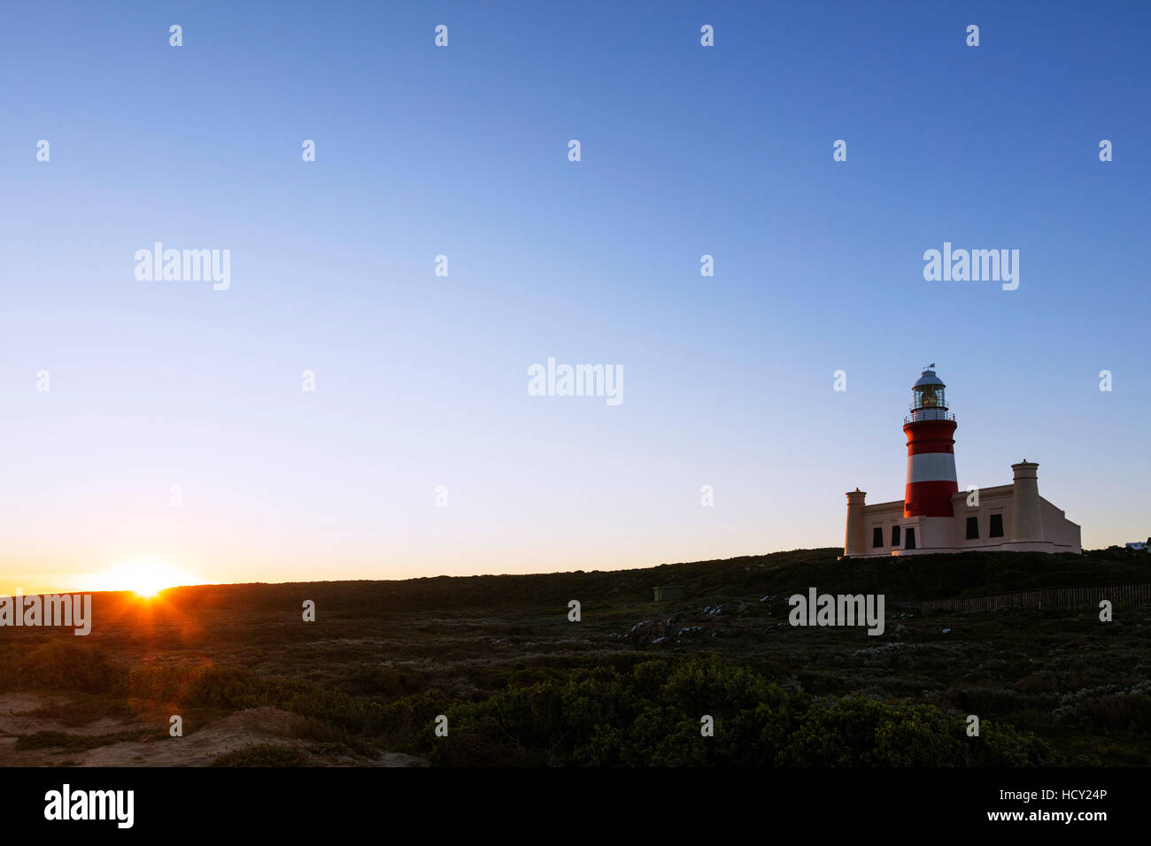 Agulhas lighthouse at southernmost tip of Africa at sunset, Agulhas ...