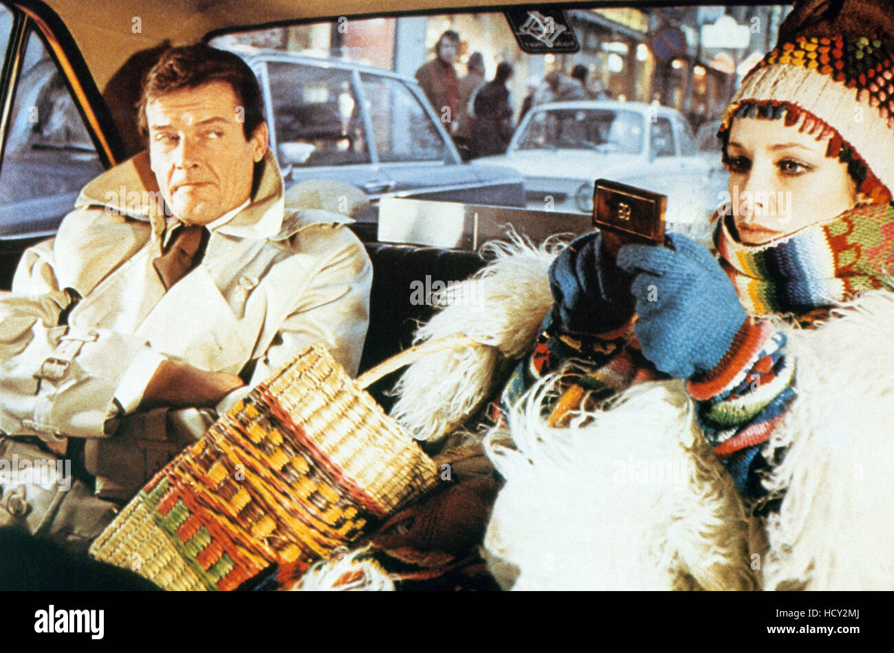 THAT LUCKY TOUCH, from left: Roger Moore, Sydne Rome, 1975 Stock Photo ...