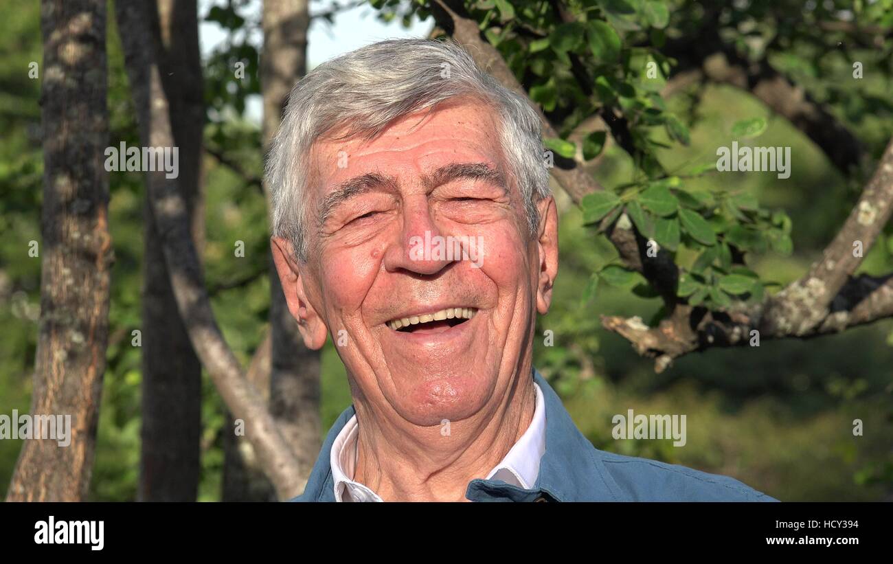 Happy Smiling Elderly Old Man Or Senior Stock Photo - Alamy