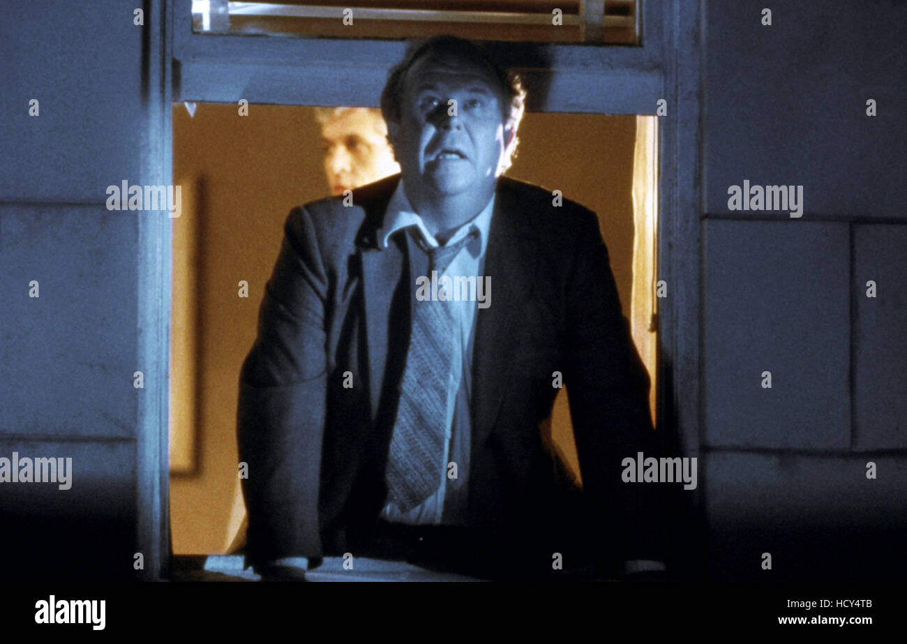 THE UNHOLY, William Russ (background), Ned Beatty, 1988. ©Vestron ...