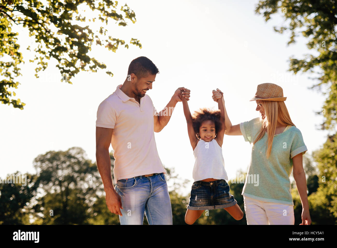 Playful family having fun outdoors and walking Stock Photo - Alamy