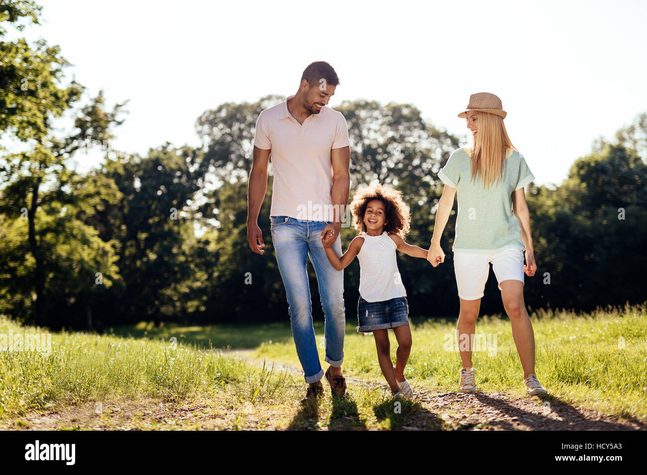 Family smiling together outdoors hi-res stock photography and images ...