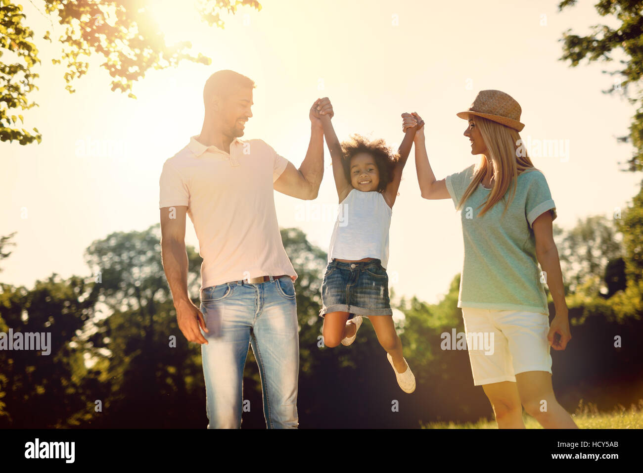 Playful family having fun outdoors and walking Stock Photo - Alamy