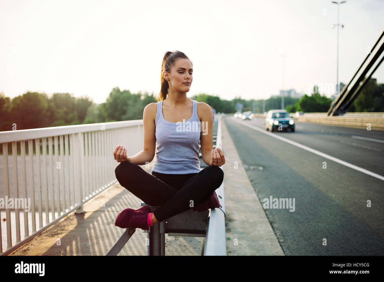 Healthy woman in lotus posture meditating Stock Photo - Alamy