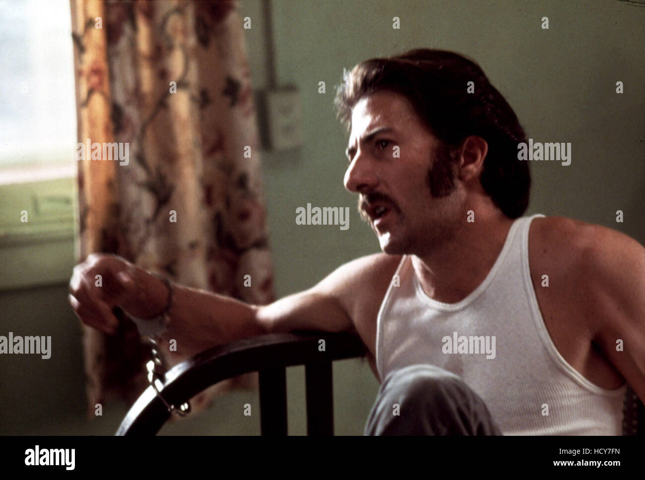 STRAIGHT TIME, Dustin Hoffman, 1978, handcuffed to a bed Stock Photo ...