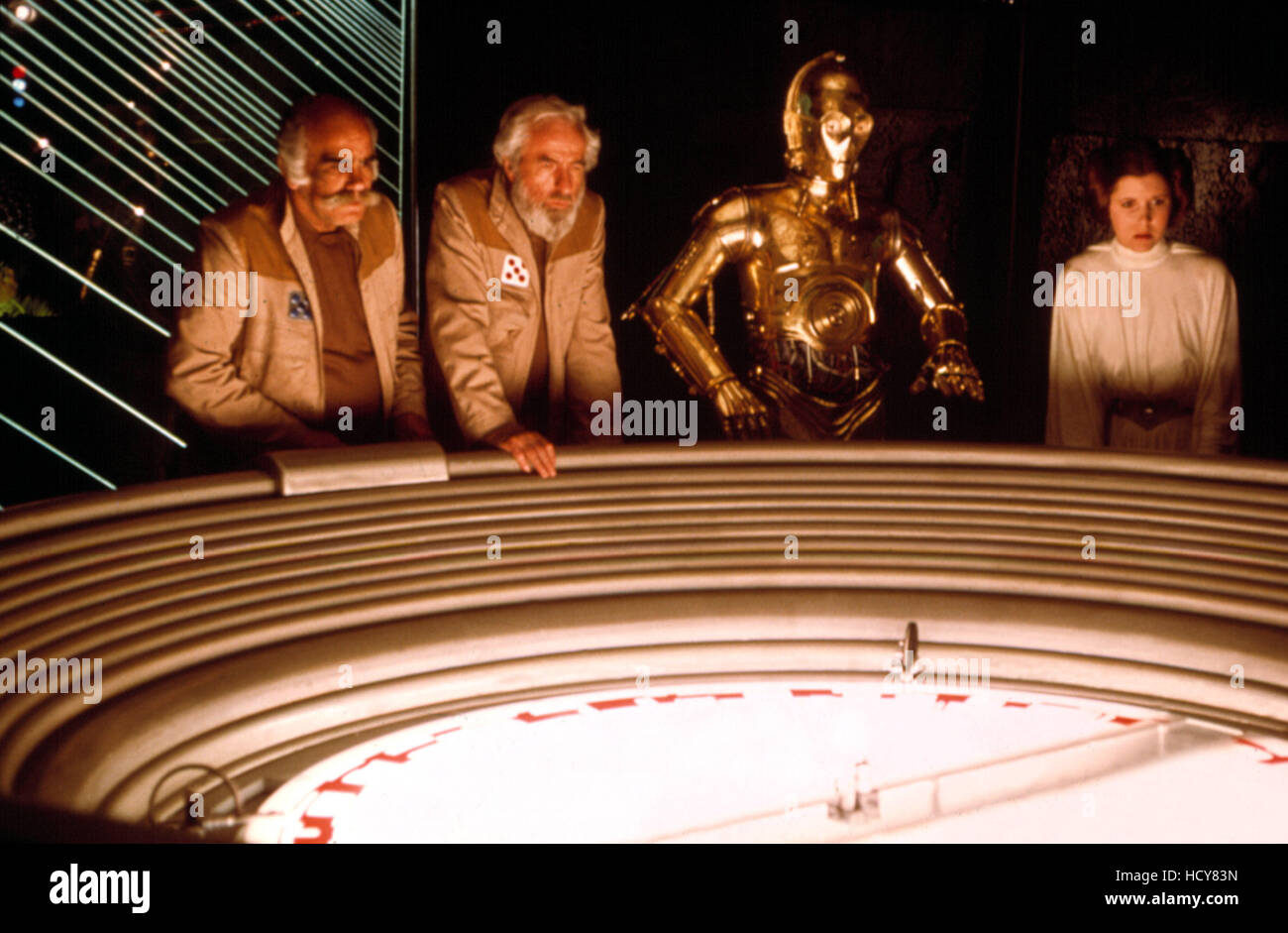 STAR WARS, (aka STAR WARS: EPISODE IV - A NEW HOPE), C3PO and Carrie Fisher, 1977 Stock Photo ...