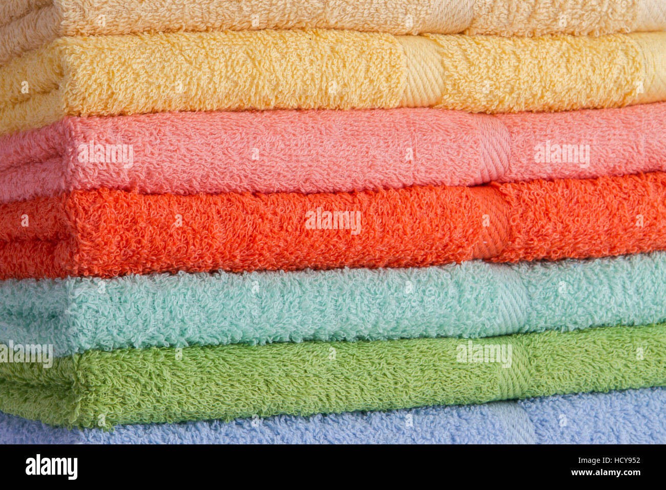 Stack of colorful towels Stock Photo - Alamy