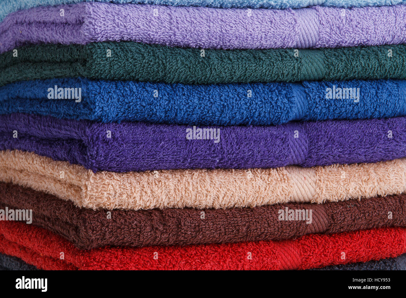 Stack of colorful towels Stock Photo - Alamy