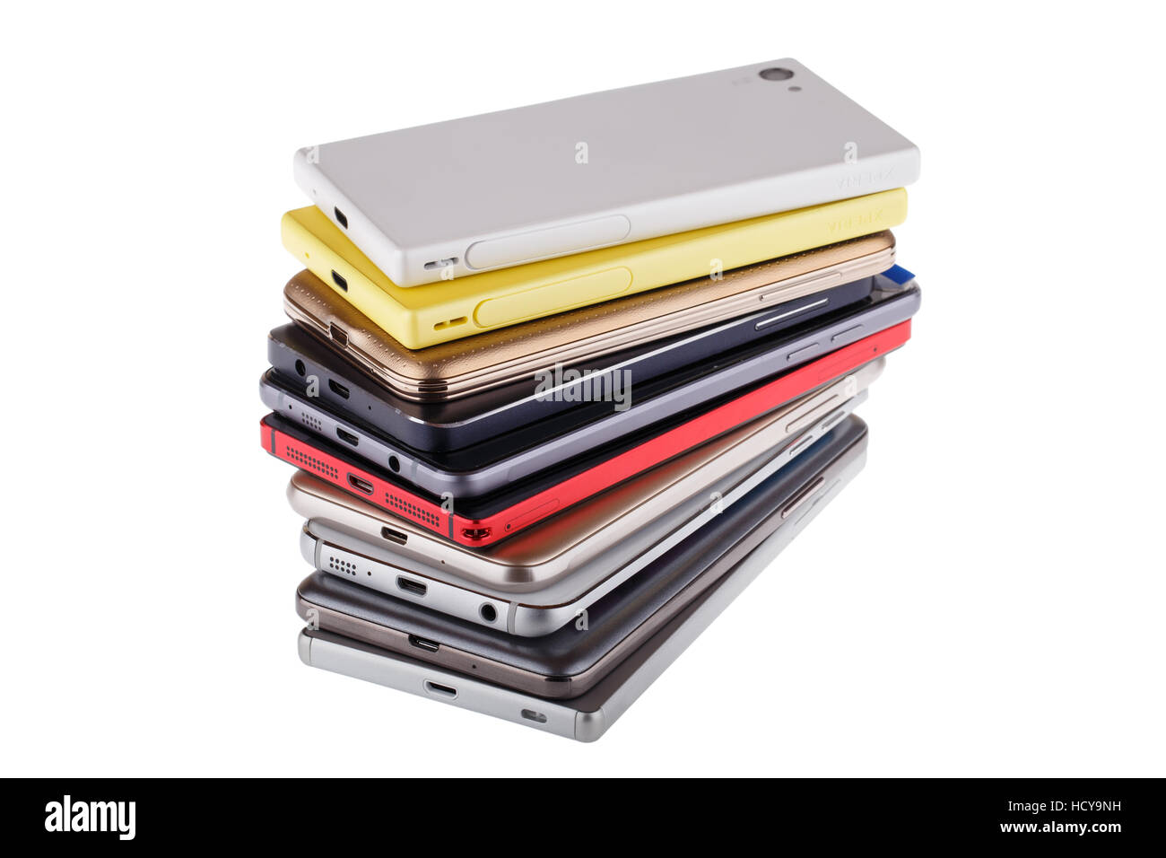 Pile of mobile phone. Heap of the different smartphones isolated on ...
