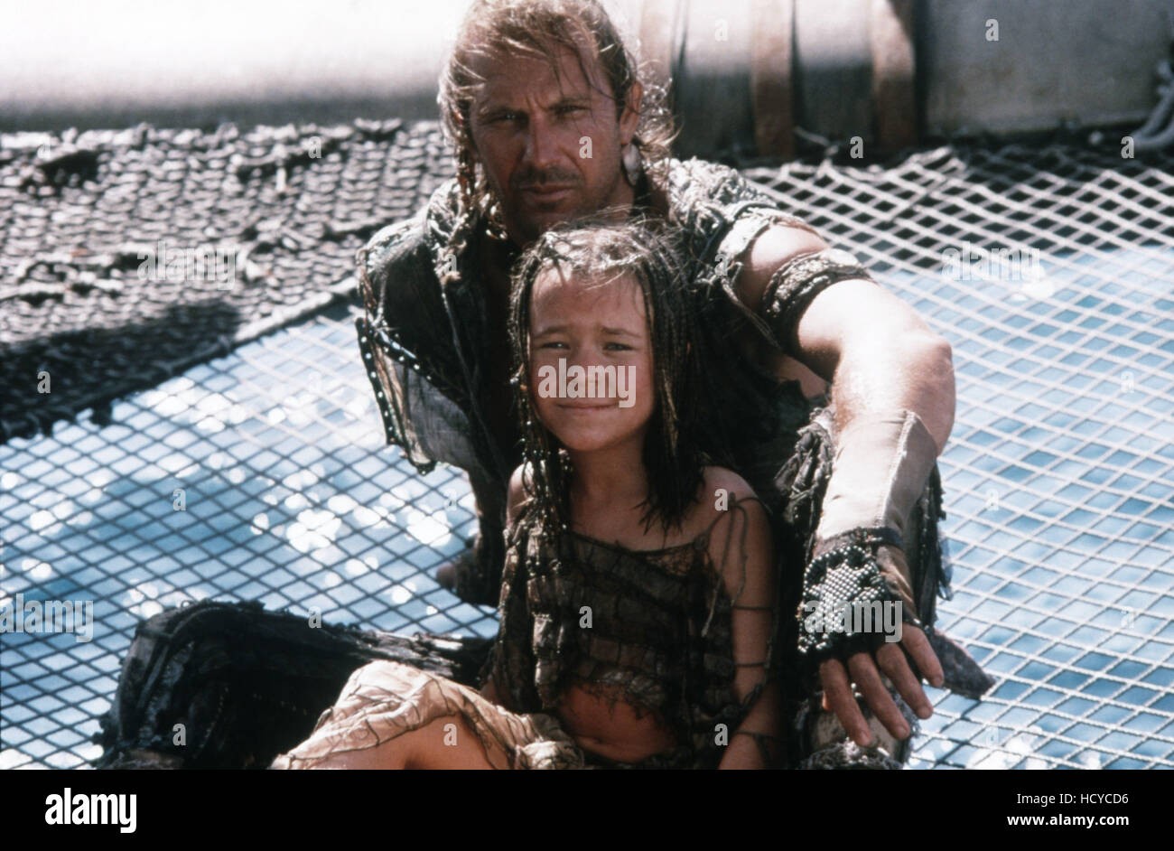 WATERWORLD, Tina Majorino (front), Kevin Costner, 1995, © Universal ...