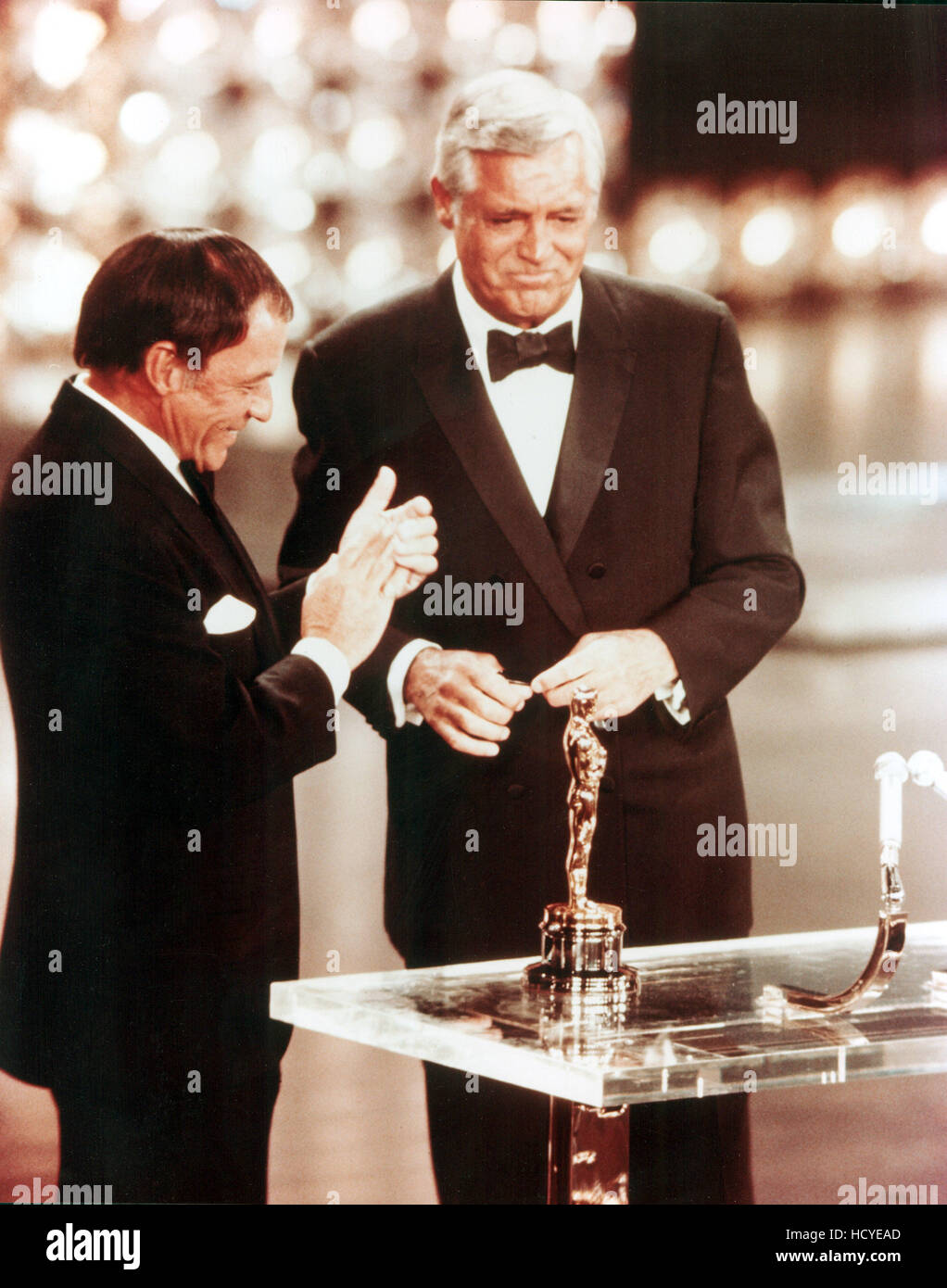 Frank Sinatra presenting Cary Grant with his honorary Academy Award ...