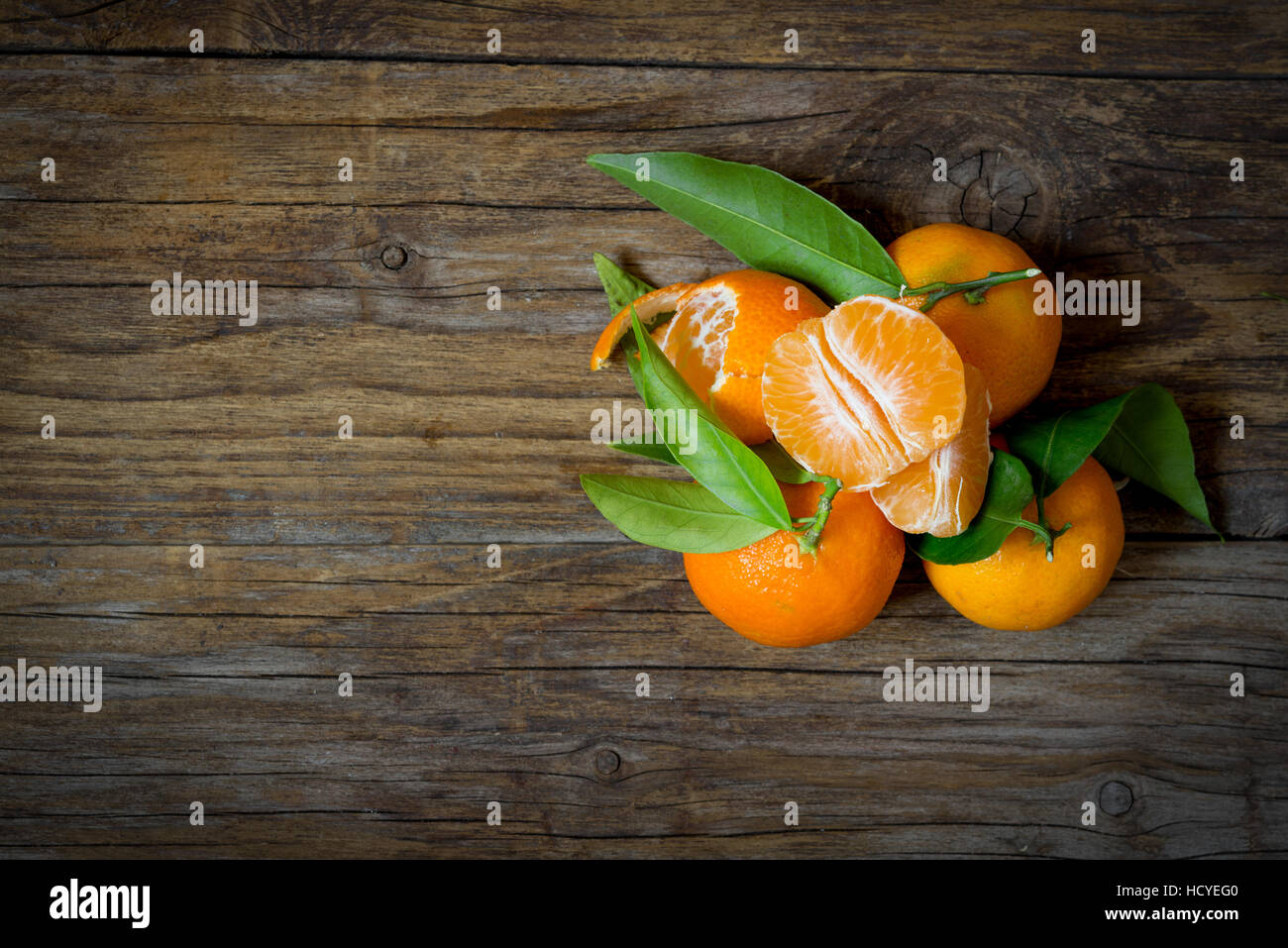 fresh natural clementine on wooden background Stock Photo - Alamy