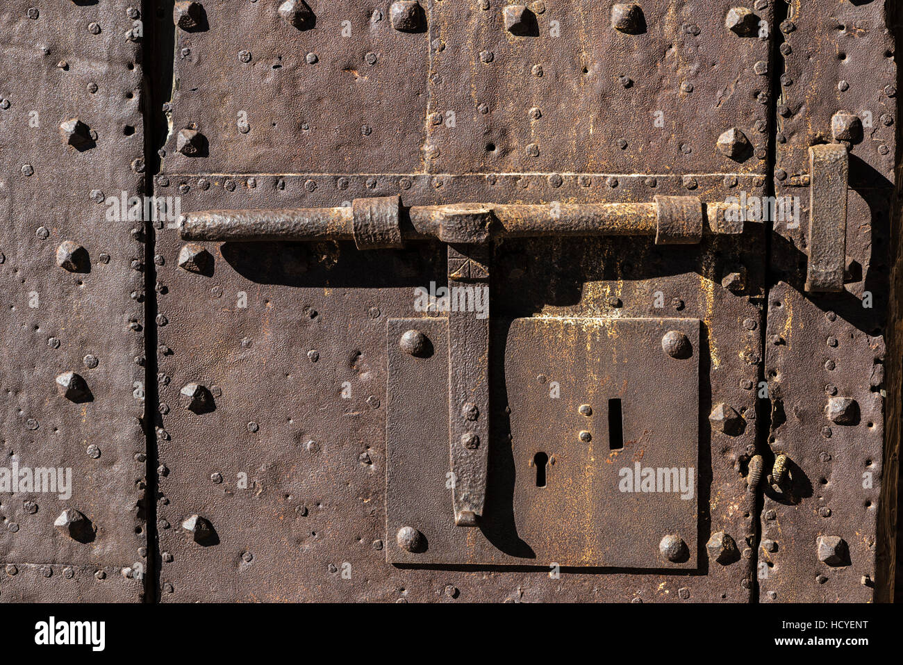 Lock on old iron rusty door of a medieval castle as background Stock ...