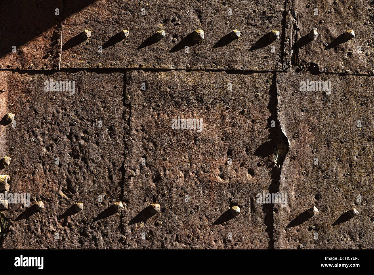 Closeup of an old iron rusty door of a medieval castle as background ...