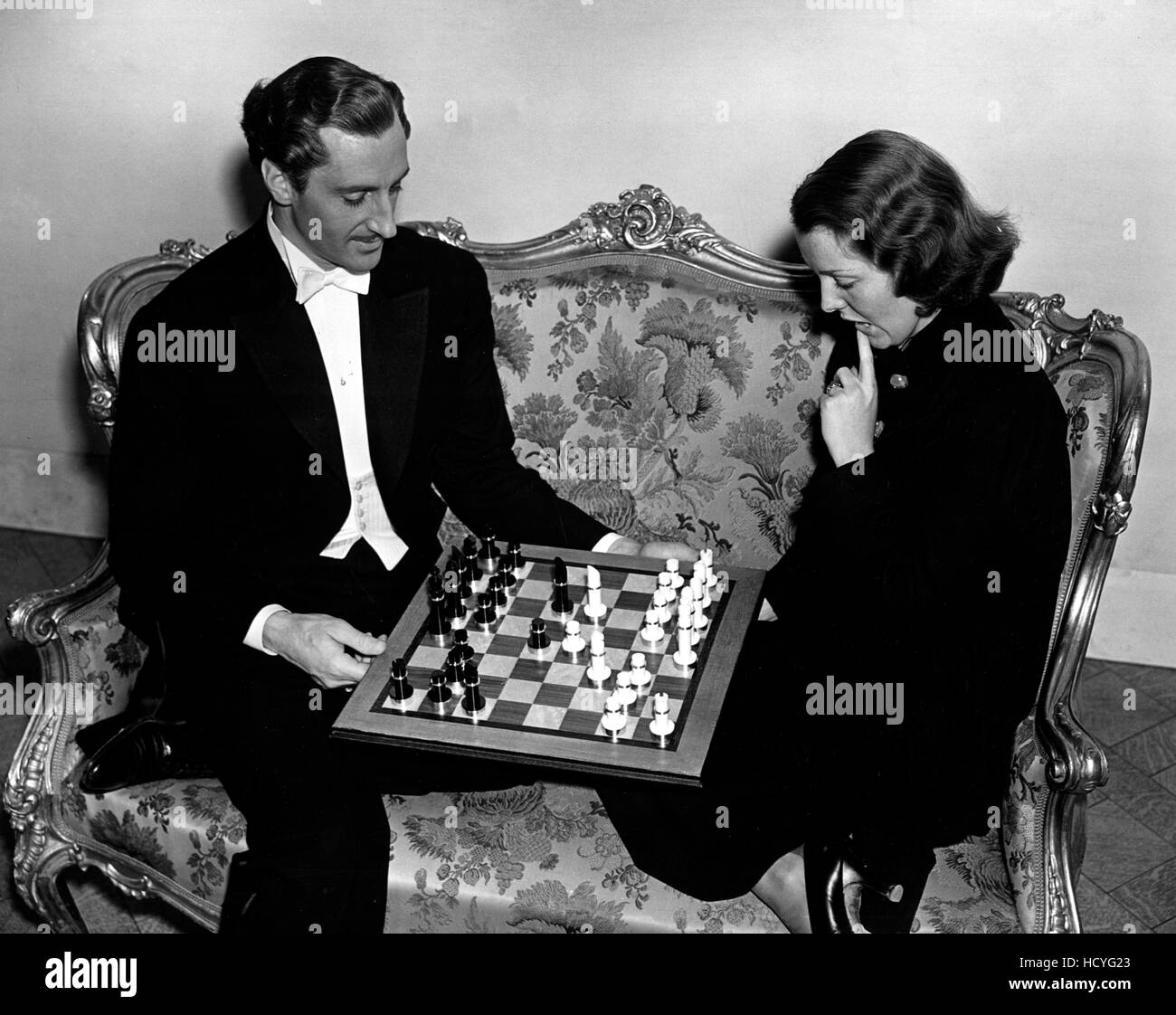 Basil Rathbone and Jane Bryan on set Stock Photo - Alamy