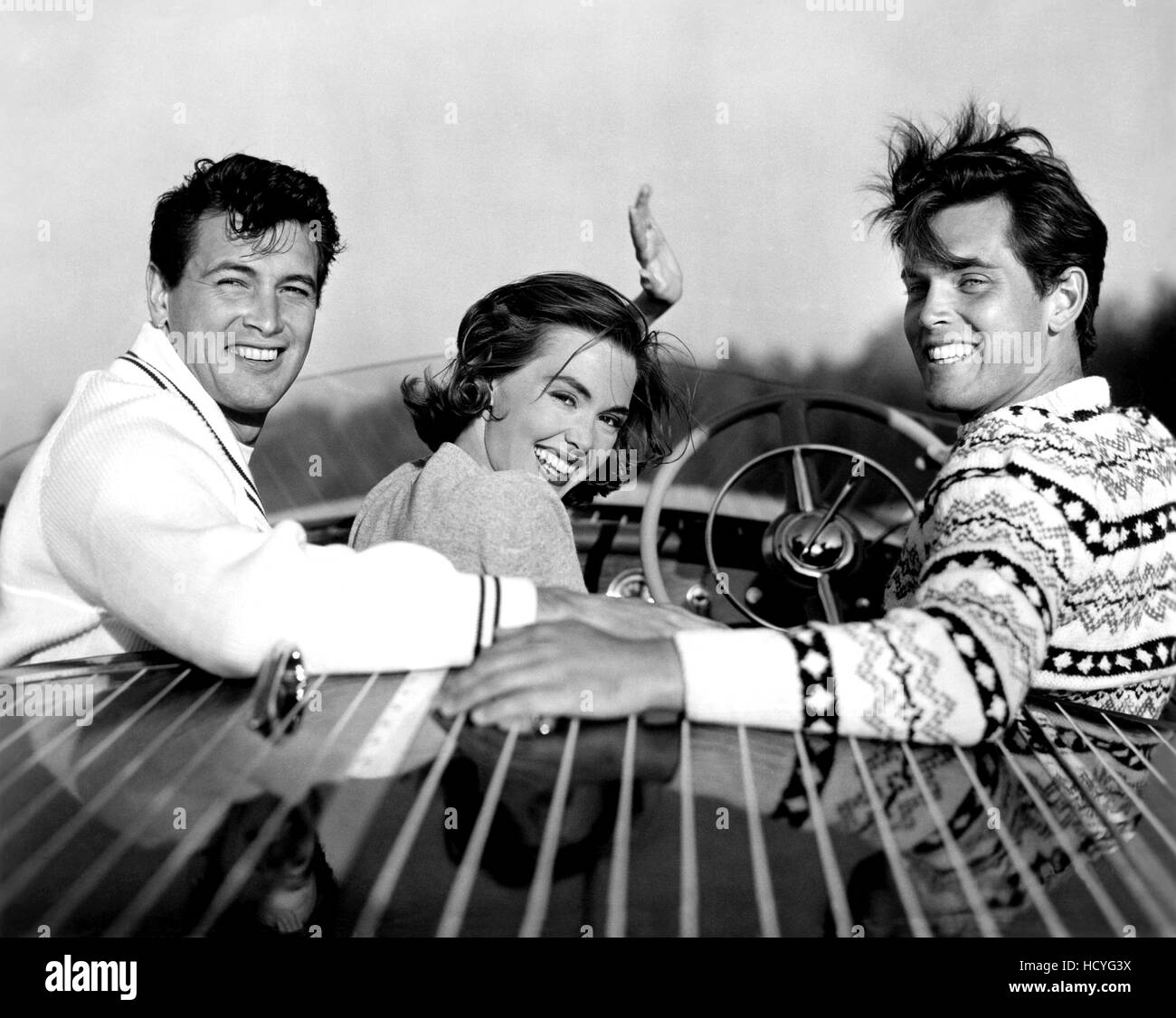 Barbara Rush and co-star Rock Hudson (left) stop to pick up her husband ...