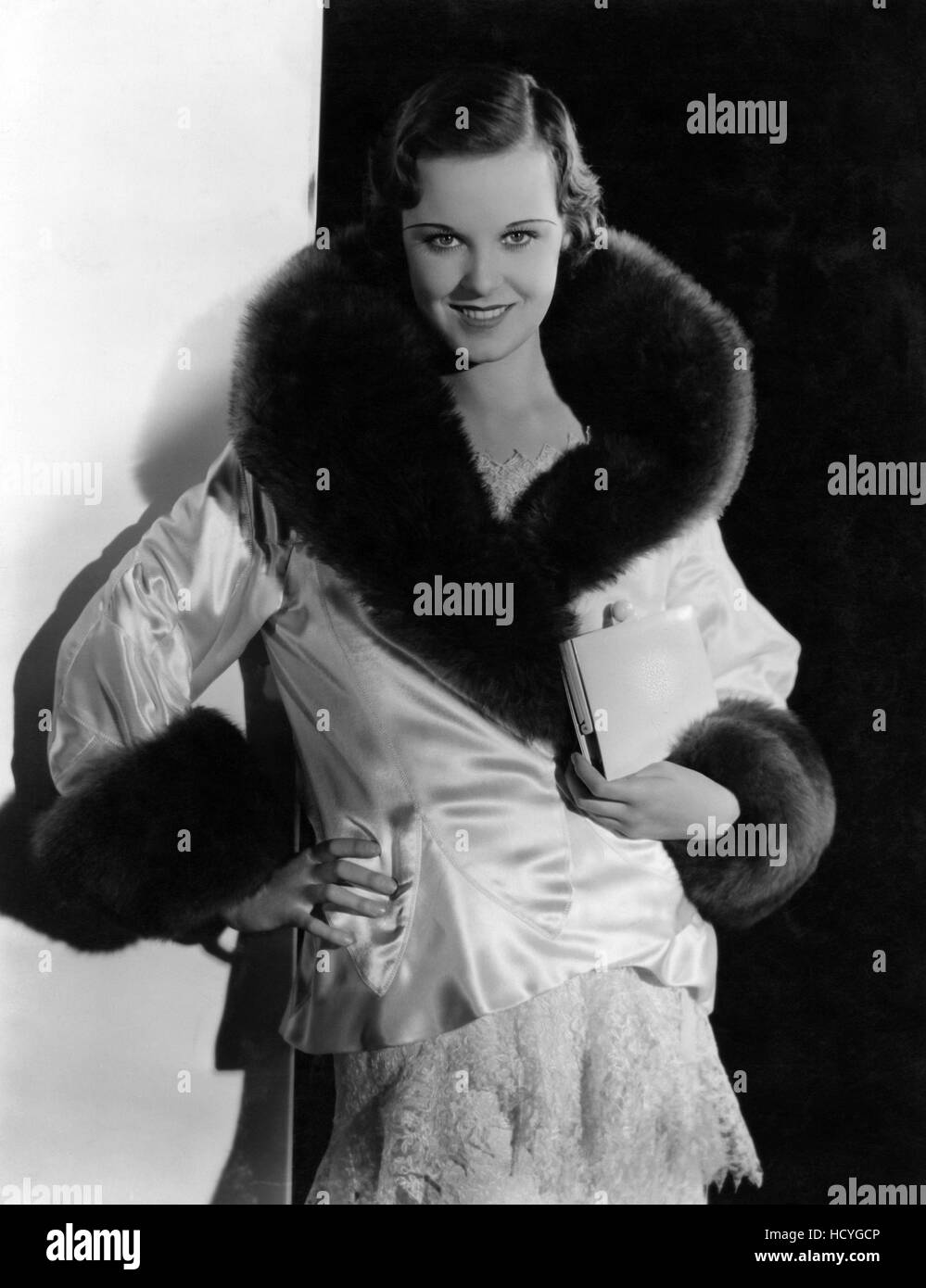 Barbara Weeks wearing dinner jacket and dress designed by Chanel, ca ...