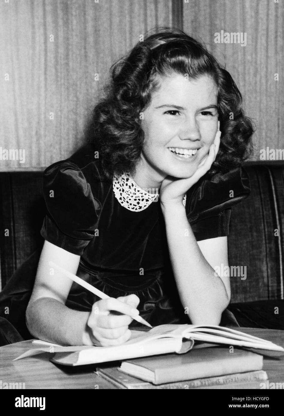 Fourteen-year-old Betty Brewer does her schoolwork on-set, 1940 Stock ...