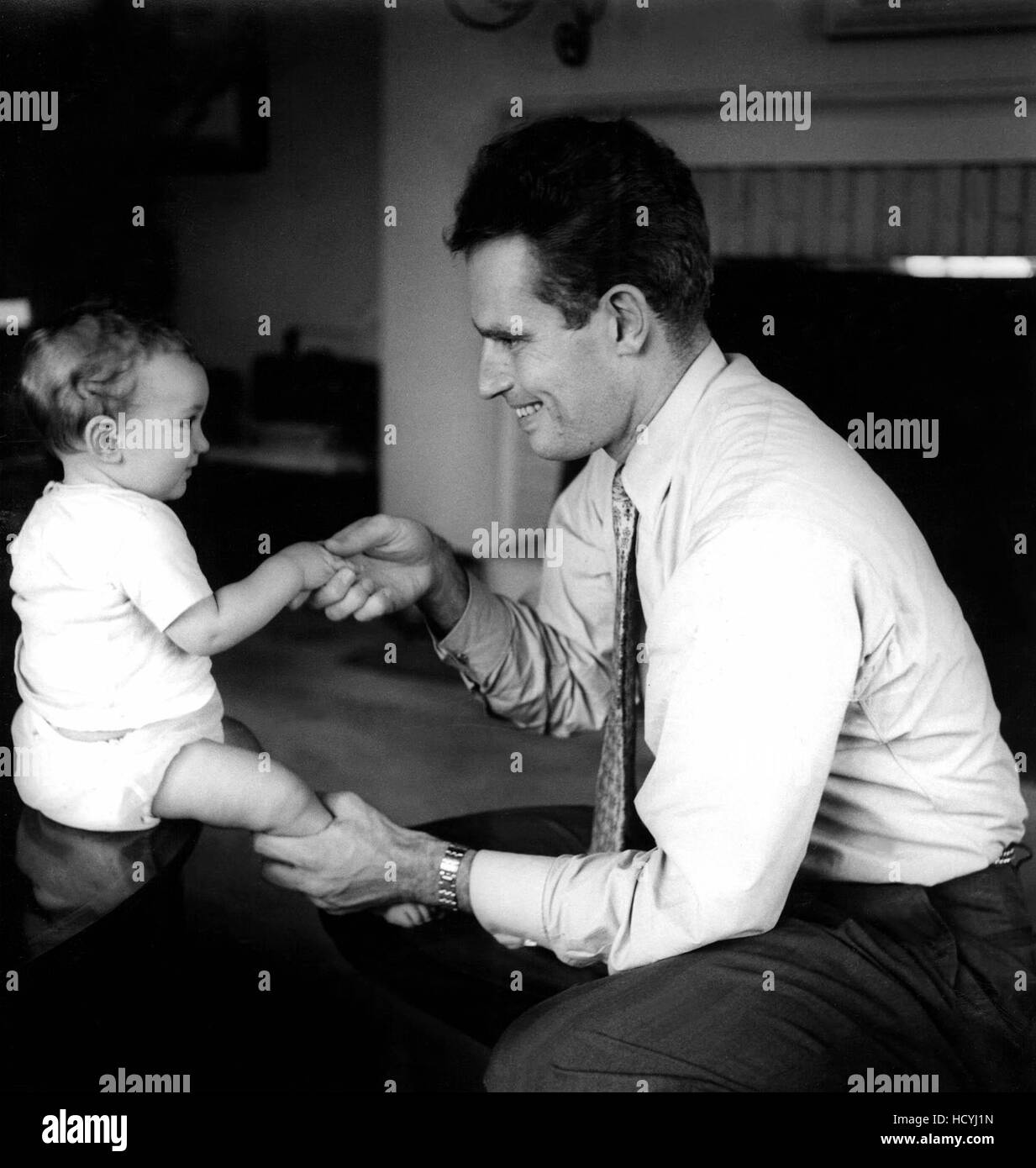 FRASIER HESTON shakes hands with his father, actor CHARLTON HESTON ...