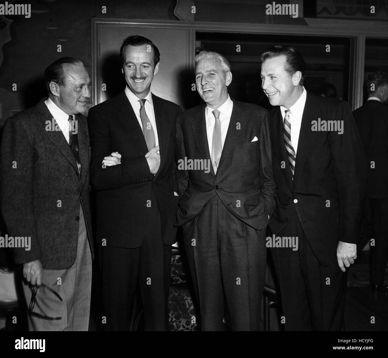 Dick Powell (r) with Jack Benny, David Niven, Buddy Adler, ca. late ...