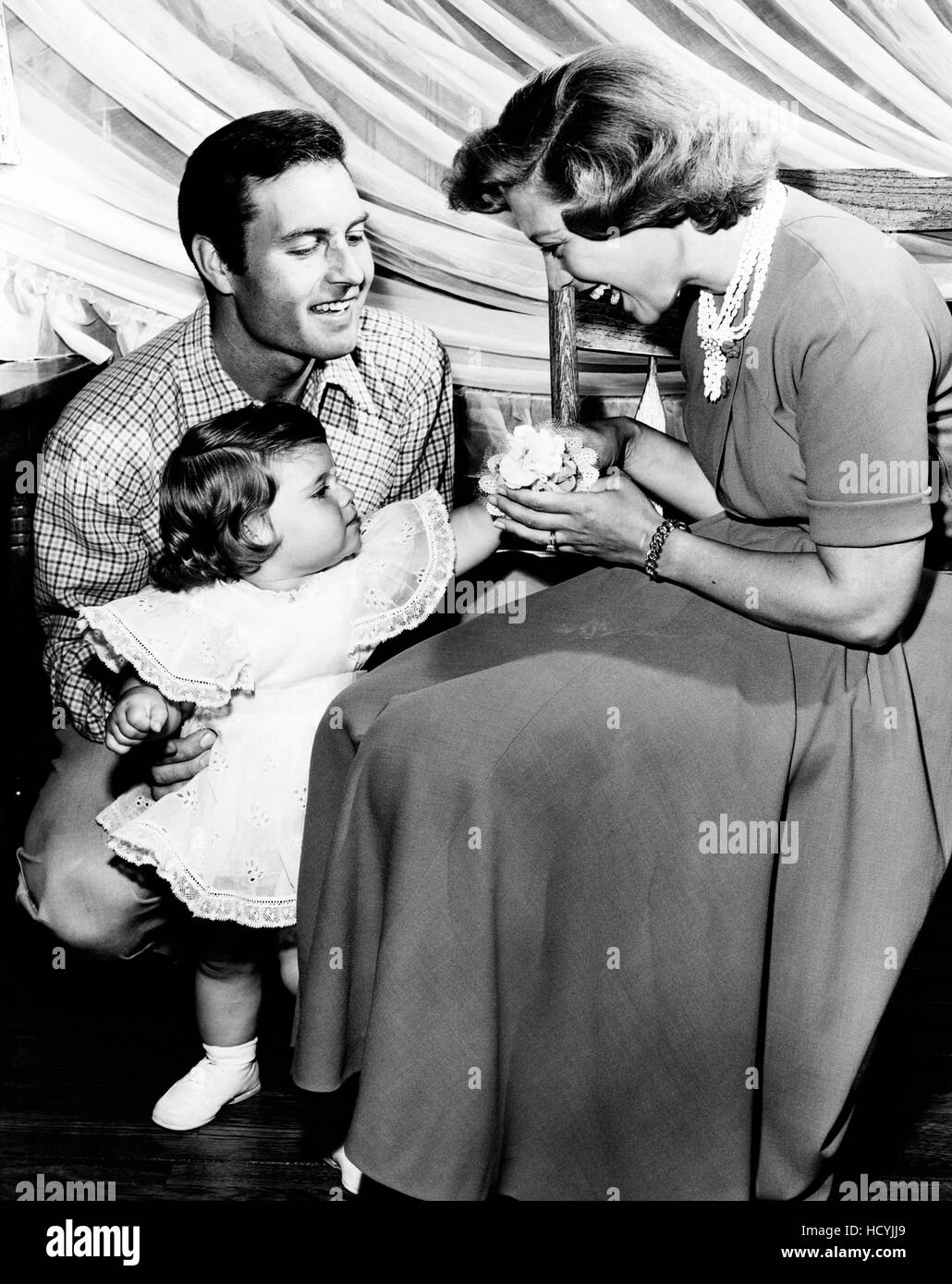 From left: George Montgomery, Dinah Shore with daughter Melissa ...