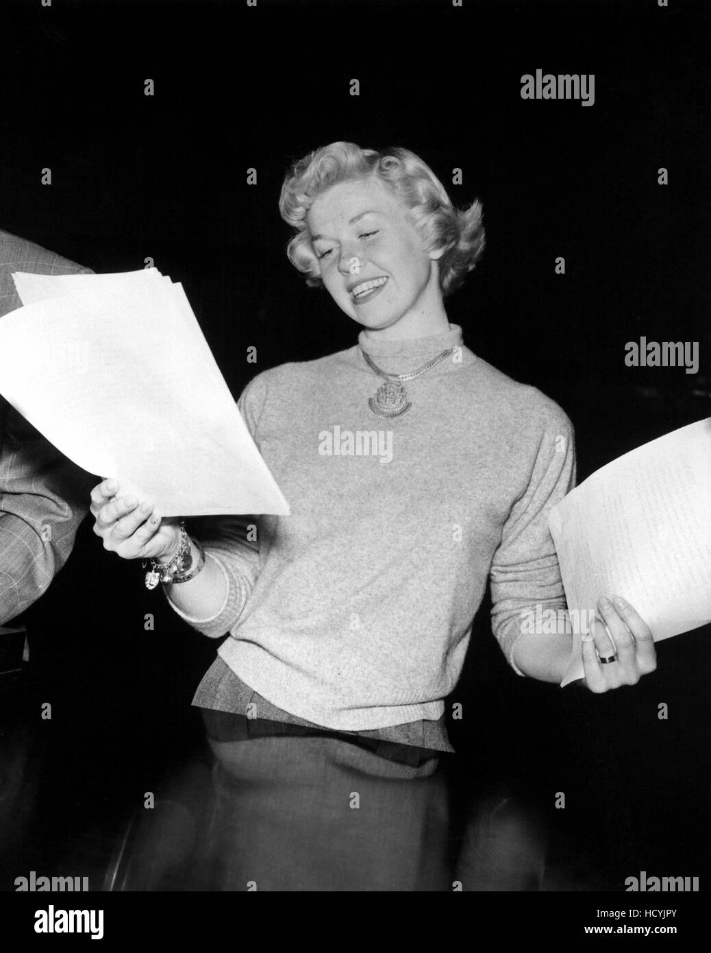 DORIS DAY rehearses a new tune for her CBS radio show, c. early 1950s ...
