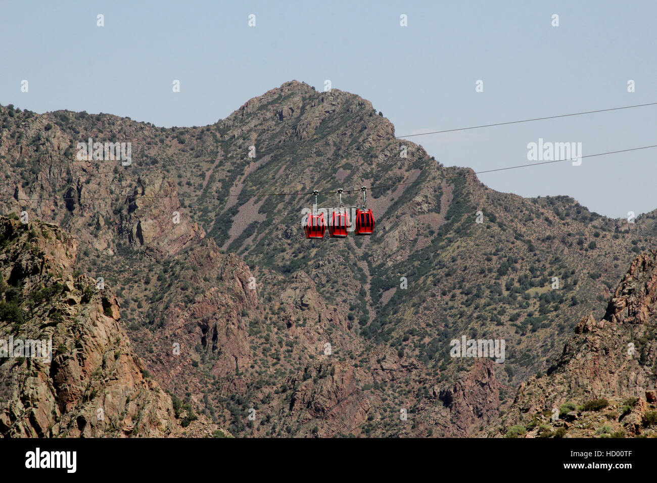 Three cable cars crossing over the Arkansas River at Royal Gorge Park ...