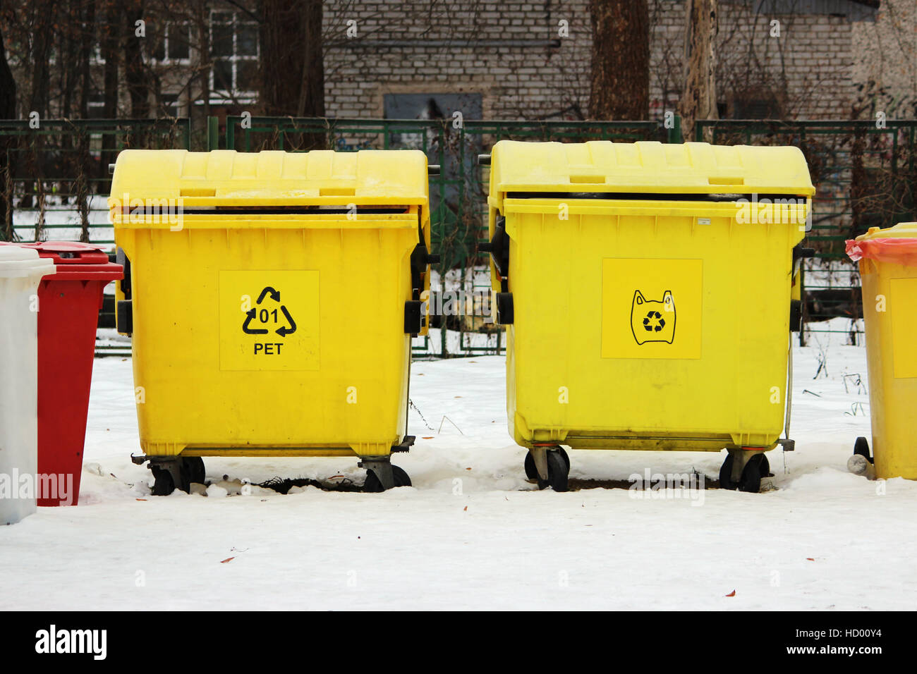 Two yellow Bins For Collection Of Recycle Materials Stock Photo - Alamy