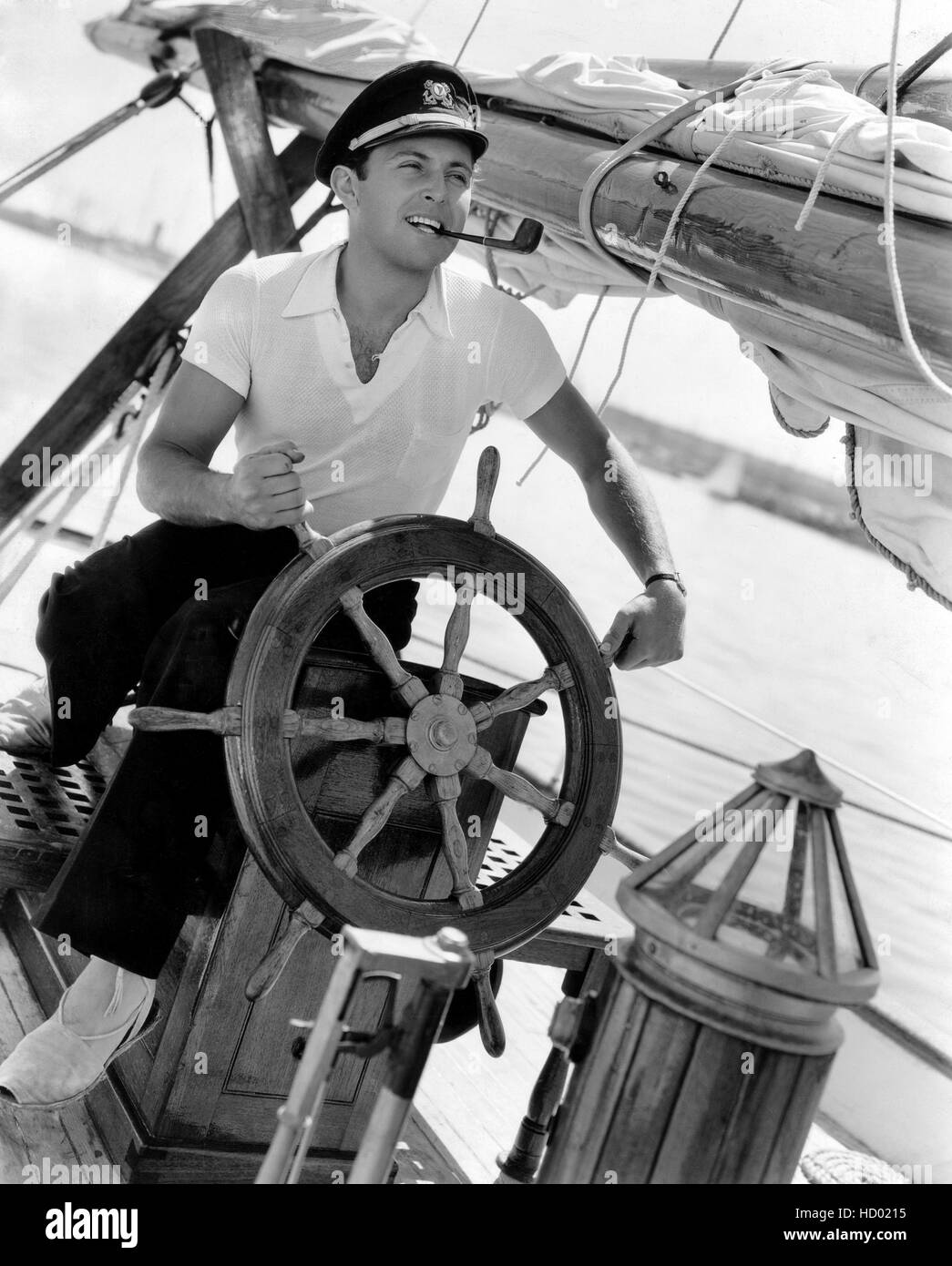 Allan Jones steering his schooner, 'Arlene,' ca. 1937 Stock Photo - Alamy