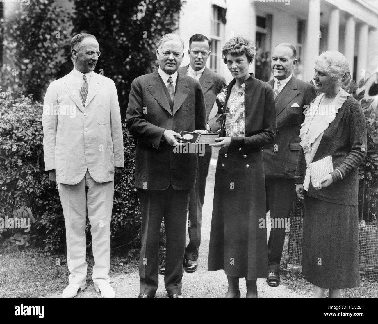 Amelia Earhart being presented a National Geographic Society medal by ...