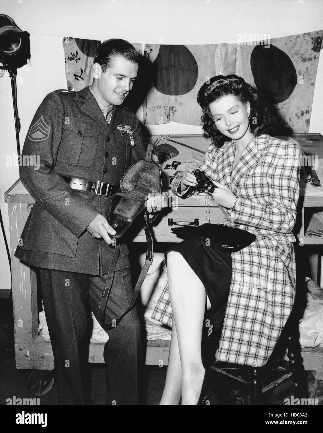 Sergeant Kenneth Dunn, left, showing Ann Miller some of his war ...