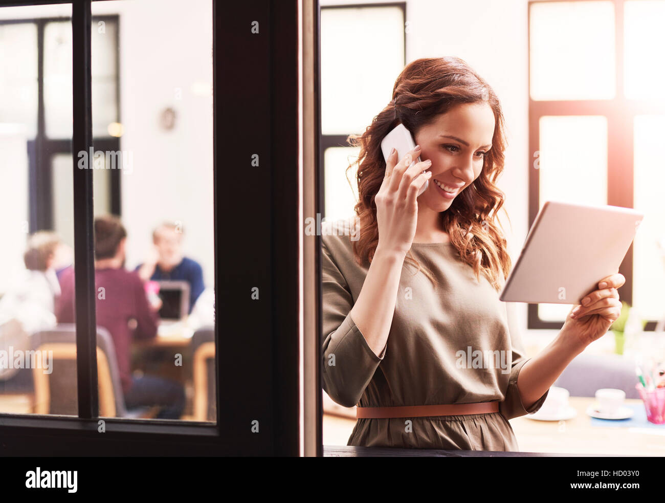 Office worker checking the time hi-res stock photography and images - Alamy