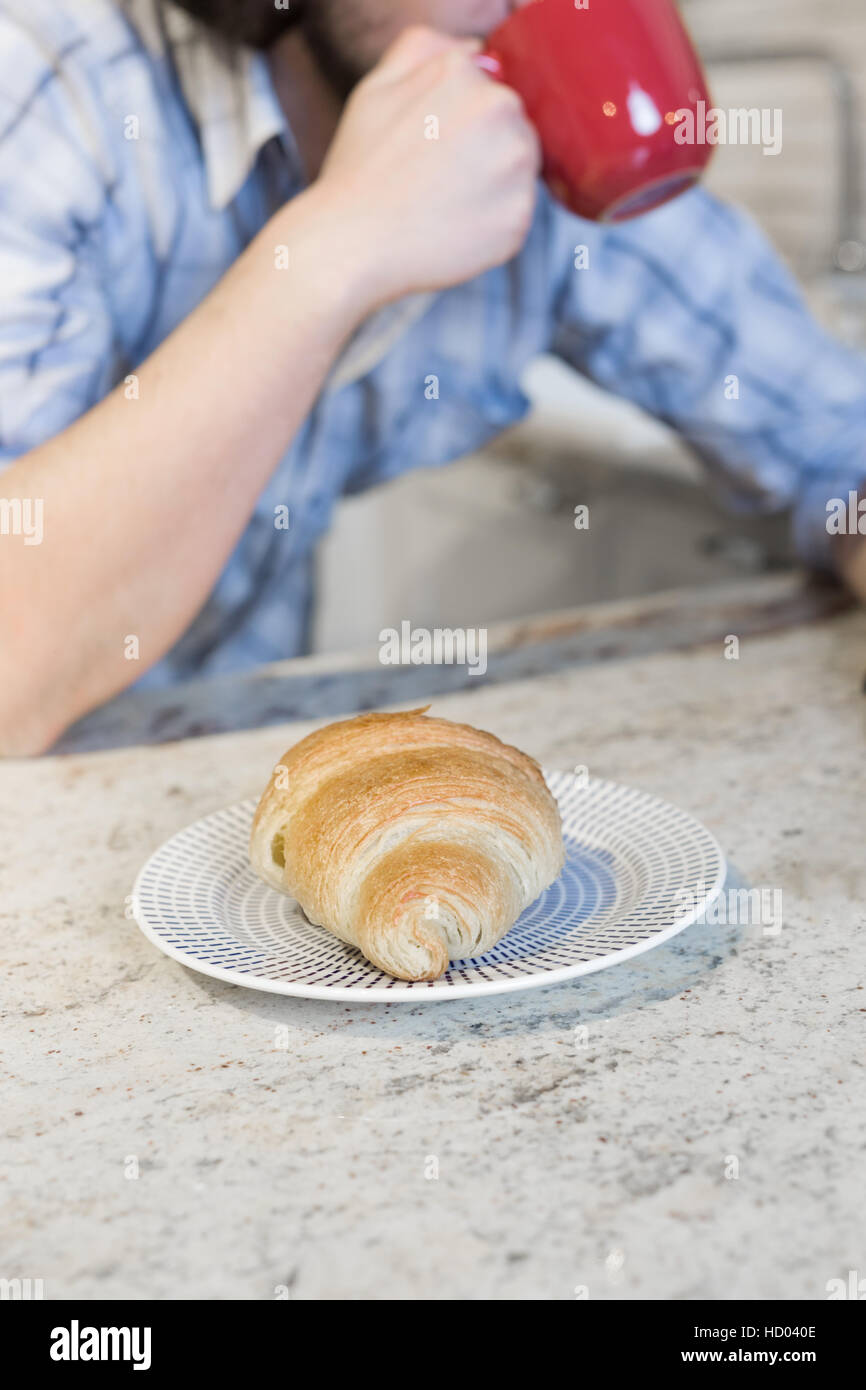 Man Eating Breakfast Using Laptop, Man in kitchen drinking coffe Stock ...