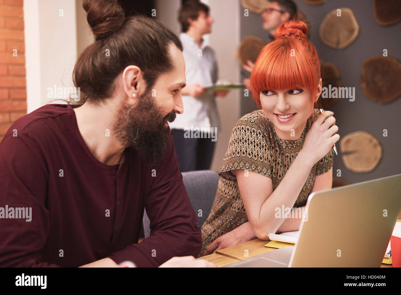 Talking with coworker at the office Stock Photo - Alamy