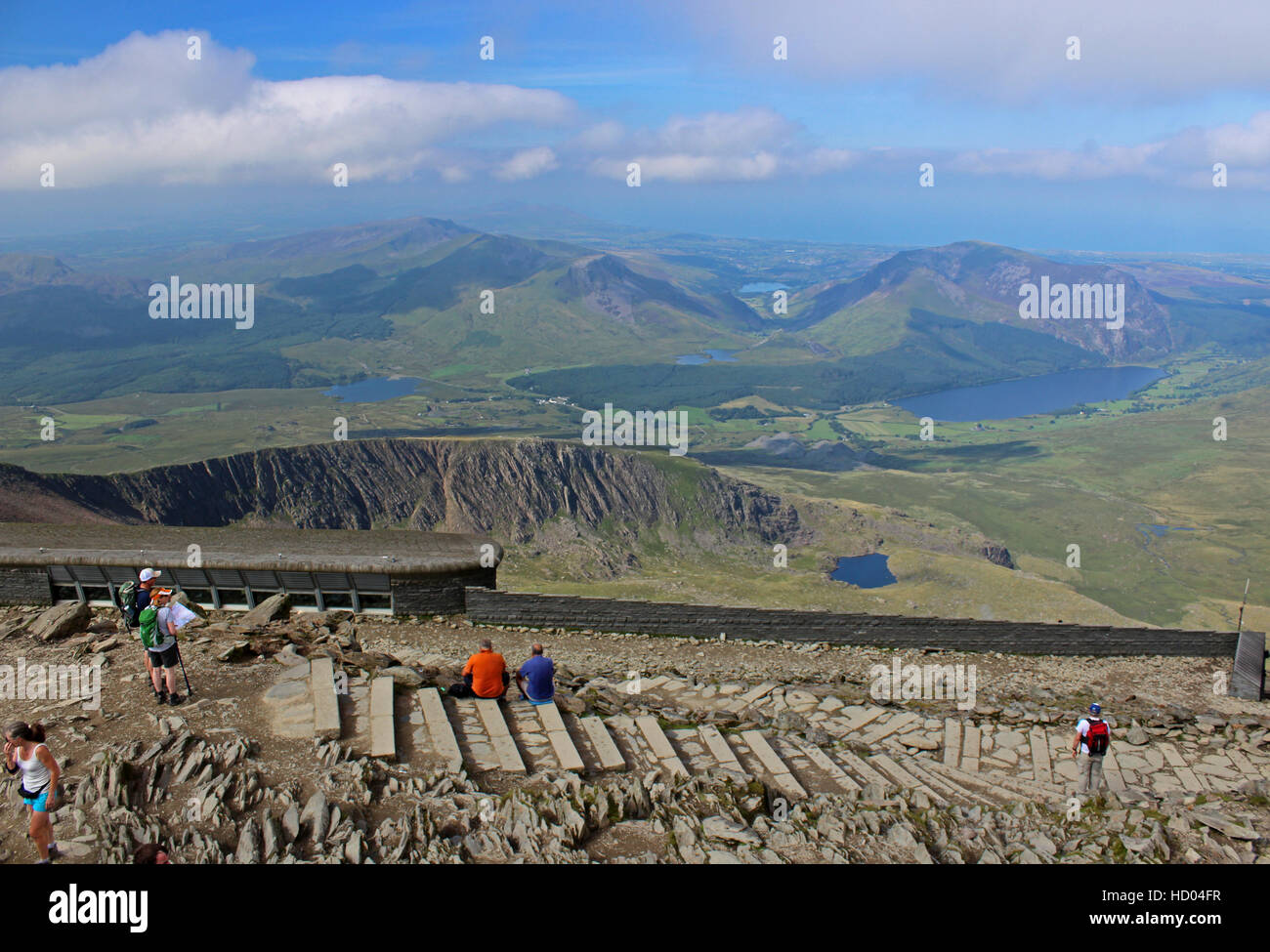 Views from summit of Snowdon in the Snowdownia National Park and people ...