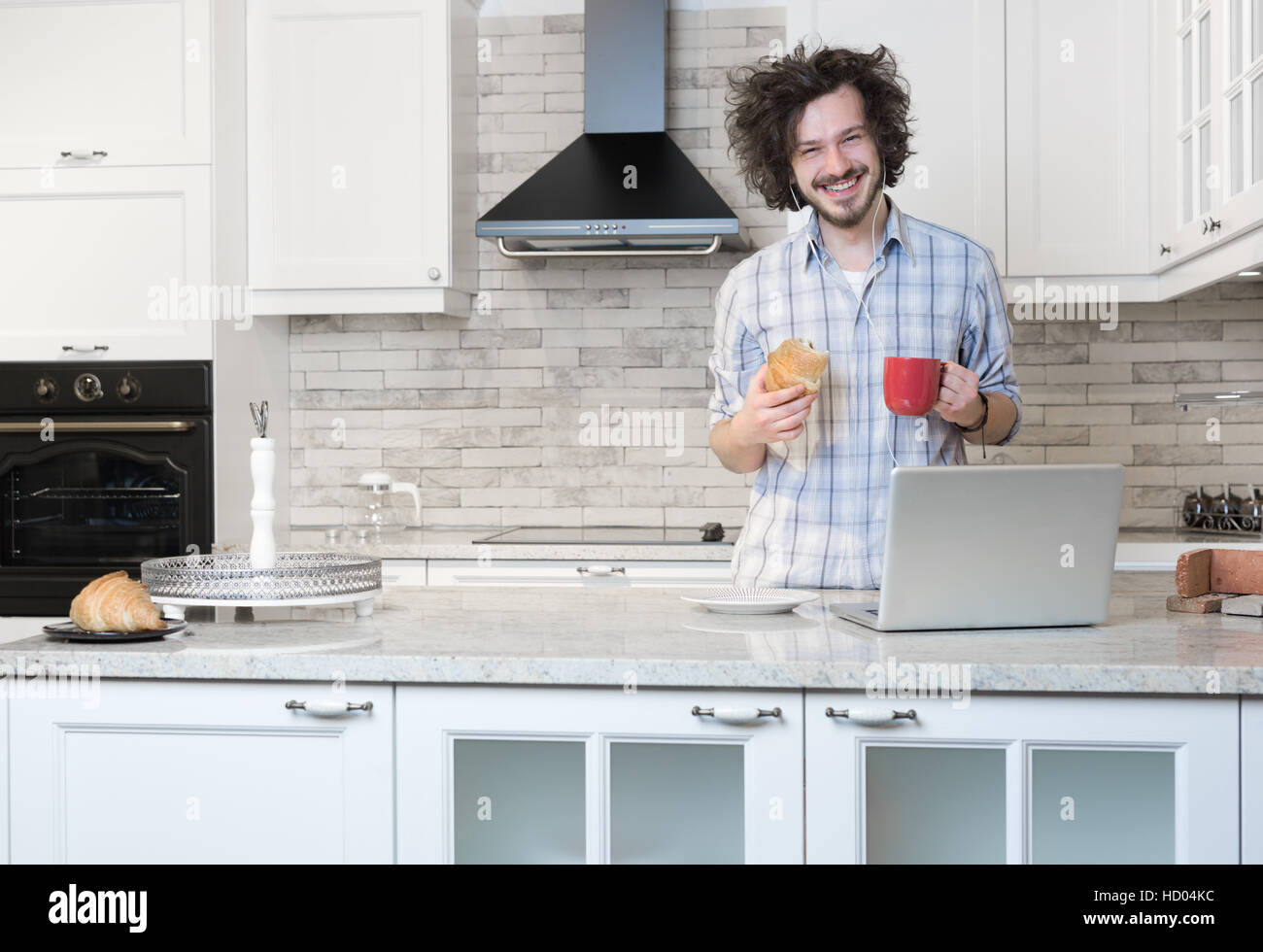 Man Eating Breakfast Using Laptop, Man in kitchen drinking coffe Stock ...
