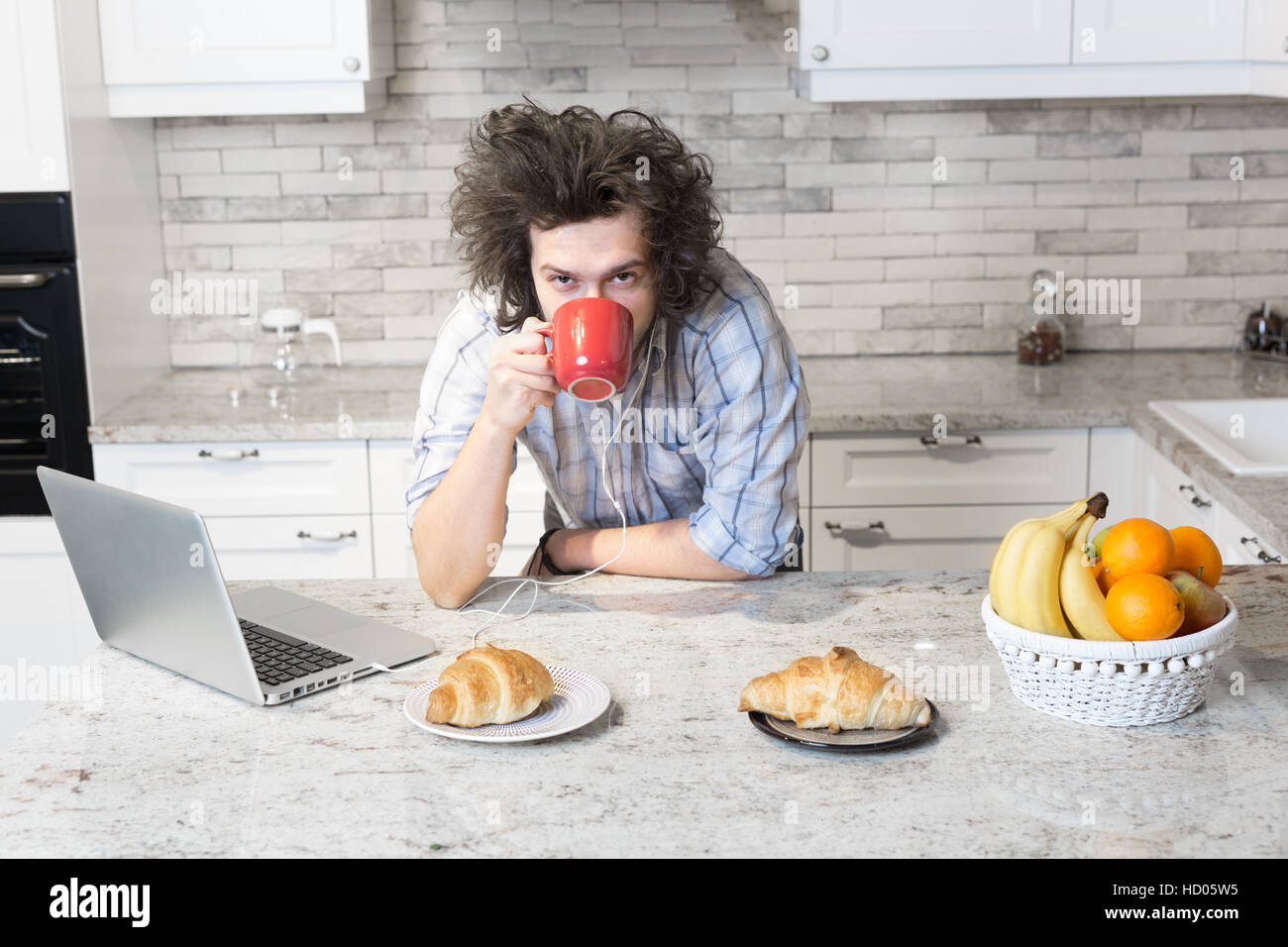 Man Eating Breakfast Using Laptop, Man in kitchen drinking coffe Stock ...