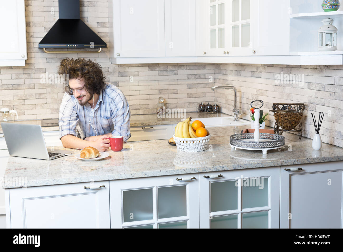 Man Eating Breakfast Using Laptop, Man in kitchen drinking coffe Stock ...