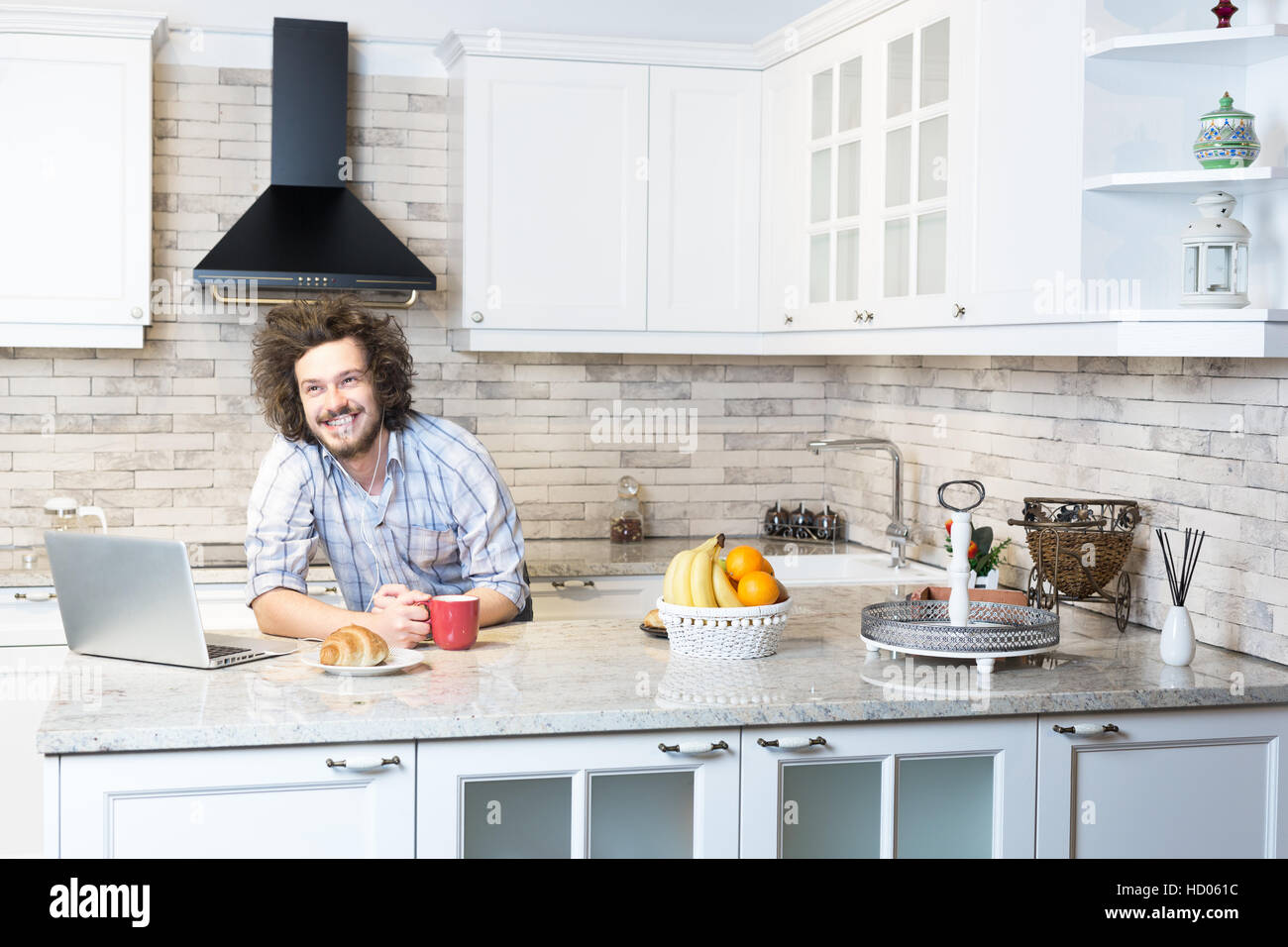 Man Eating Breakfast Using Laptop, Man in kitchen drinking coffe Stock ...